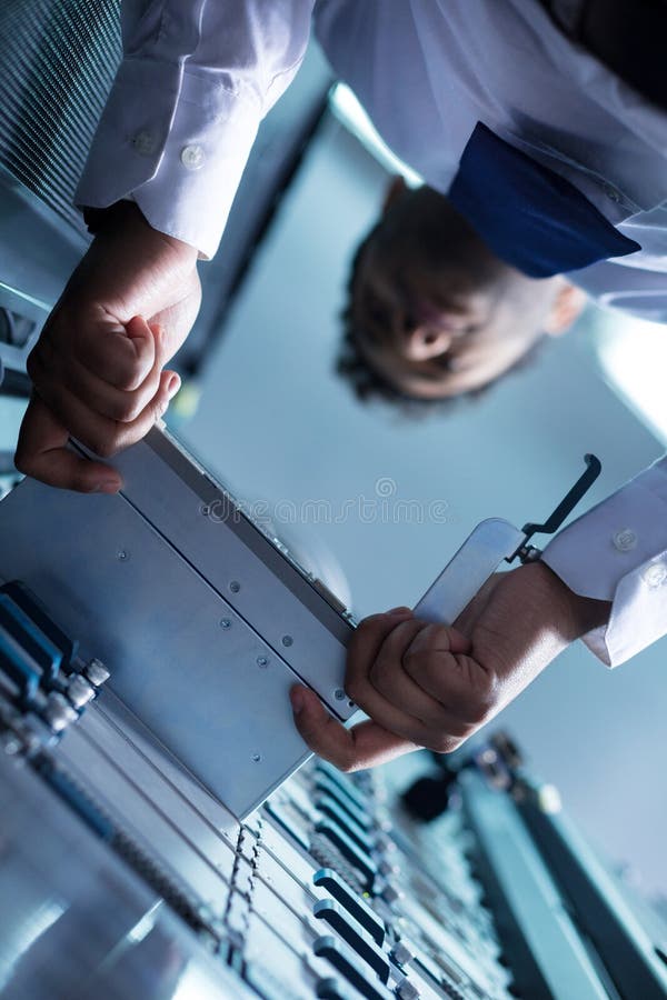 Intelligent Smart Engineer Working with the Blade Server Stock Image ...