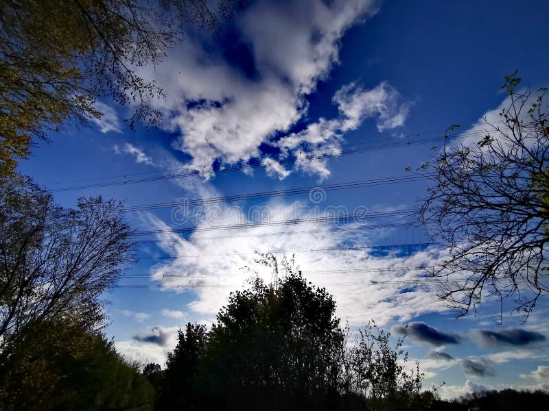 Intense Blue in the Sky with a Few Pompous Clouds Stock Image - Image ...
