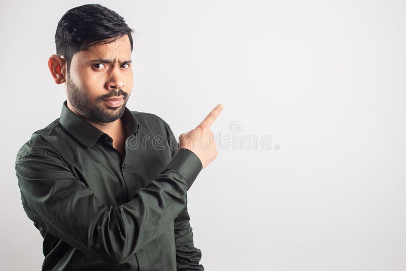 Intense Looking Indian Man Presenting on Empty Space Stock Photo ...