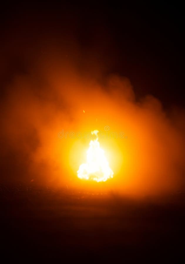 Intense Orange Fire Burning at Night in a Smoky Desert Landscape Stock ...