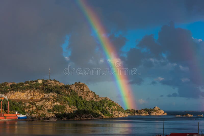 Intense Rainbow Rising Above Cliffs Stock Photo - Image of landscapes ...