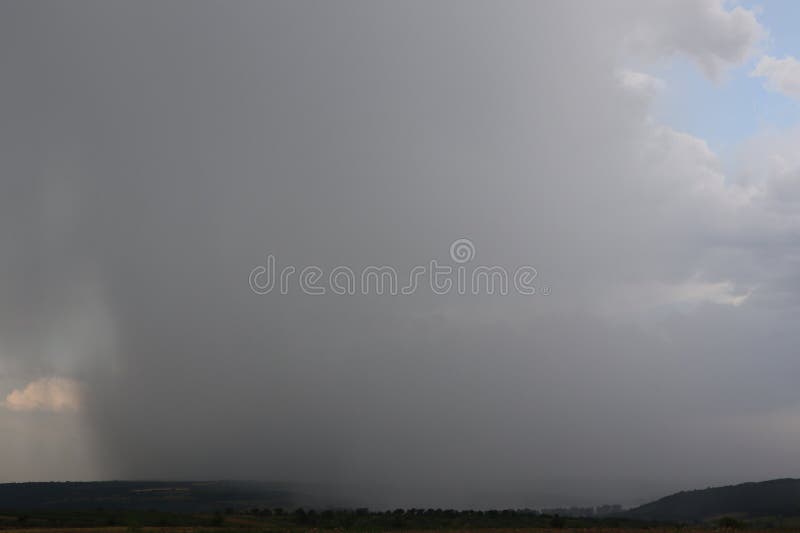 Intense Rainstorm with Dark Clouds and Heavy Rainfall Creates Dramatic ...