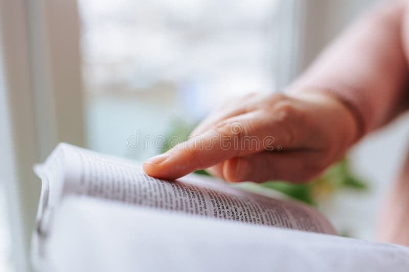 Intense Reading Close-Up of Unrecognizable Hands Holding Literature ...