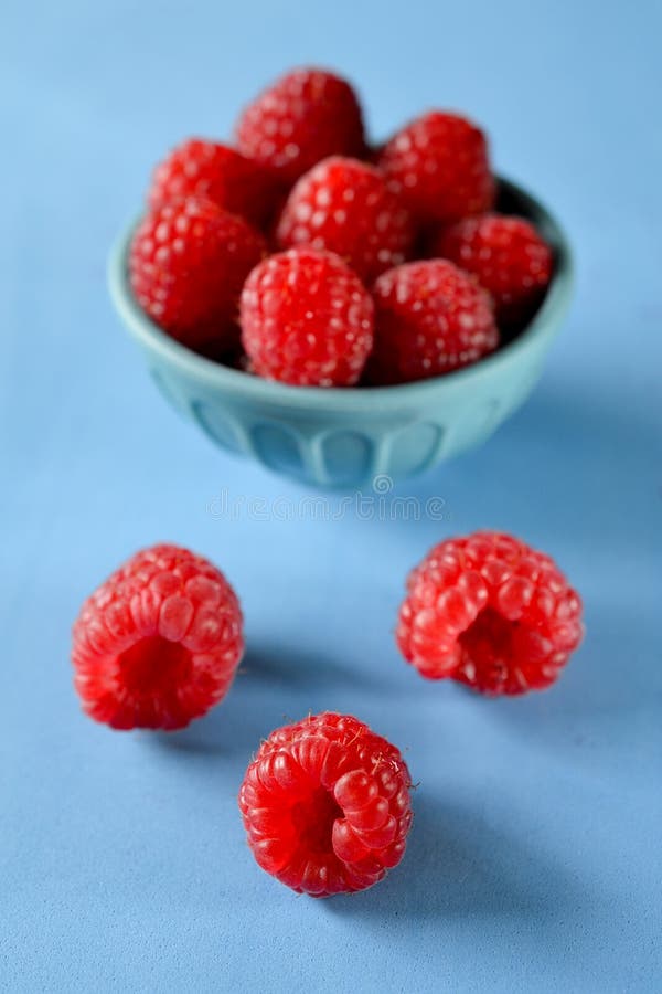 Intense Red Raspberries on Blue Stock Image - Image of blue, berry ...