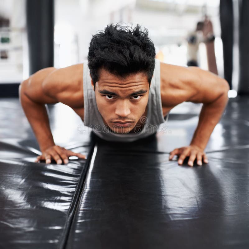 Intense Training. a Focused Young Boxer Doing Push-ups in the Gym ...