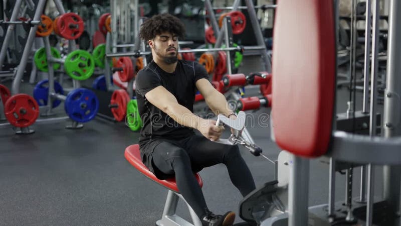 Intensive Workout in Gym, Man Doing Cable Row Exercise, Slow Motion ...