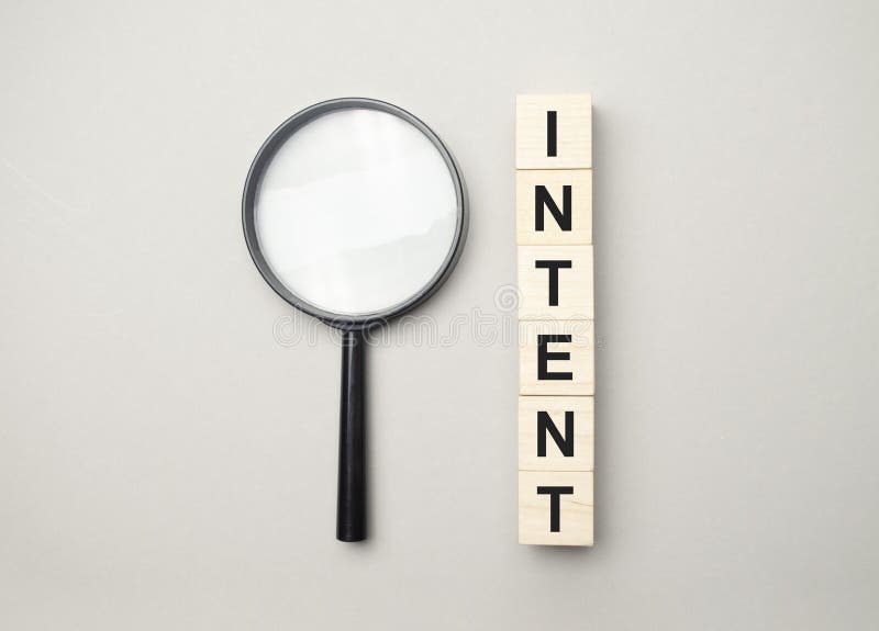 Intent Words on the Wooden Blocks and Magnifier Stock Image - Image of ...