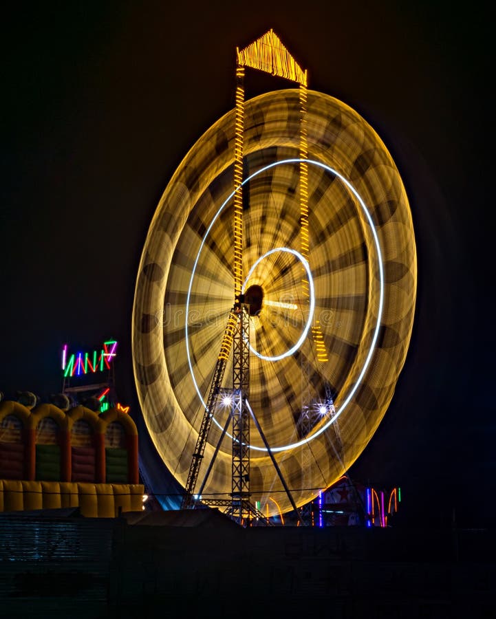 Giant Ferris Wheel in an Amusement Park Stock Photo - Image of clouds ...