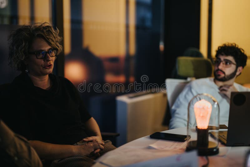Inter Generational Colleagues Discussing Business Growth and Marketing ... Inter Generational Colleagues Discussing Business Growth and Marketing ...