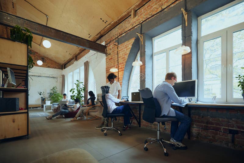 Interactive Co-working Space. Bustling Co-working Environment with ...