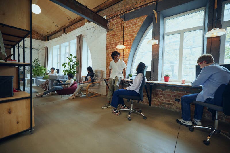 Interactive Co-working Space. Bustling Co-working Environment with ...