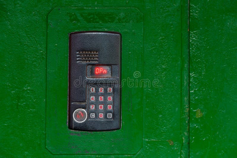 An Intercom on Green Painted Red Steel Surface with a Keypad, Digital ...