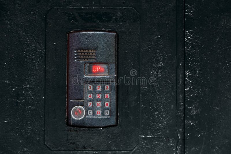 An Intercom on Old Black Painted Steel Surface with a Keypad, Digital ...