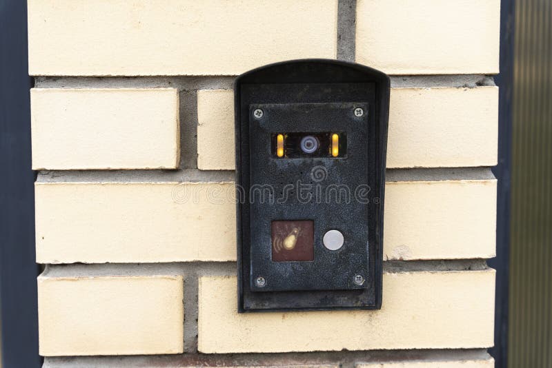 Intercom Panel with a Video Camera on the Brick Fence of Private House ...