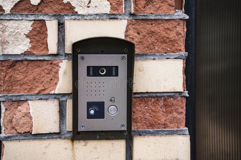 Intercom Panel with a Video Camera on the Brick Fence of Private House ...