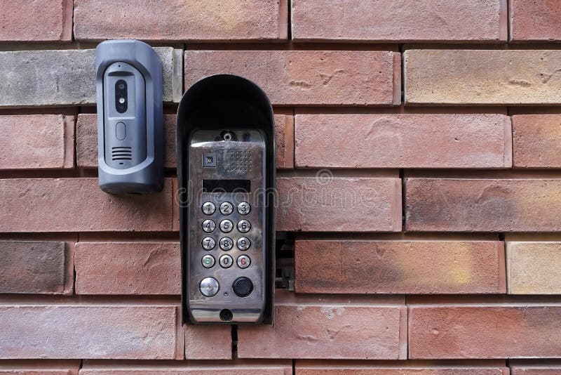 Intercom and Security Camera on the Brick Wall Outside Building Stock ...