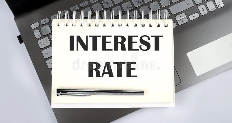 INTEREST RATE - Top View Notebook Writing on the Laptop Stock Photo ...