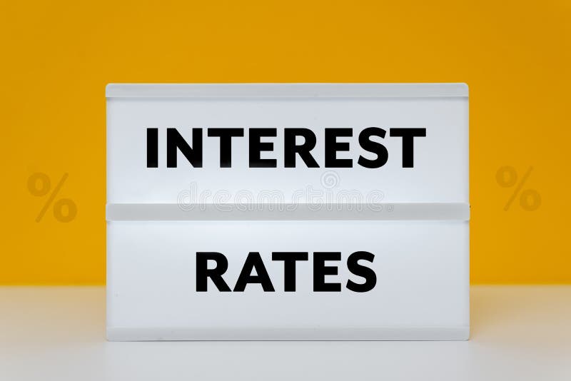 Interest Rates on White Box with Yellow Background Stock Photo - Image ...