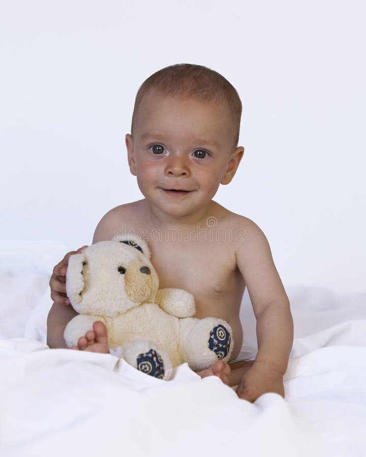 Interested Baby Playing with Teddy Bear Stock Photo - Image of ...