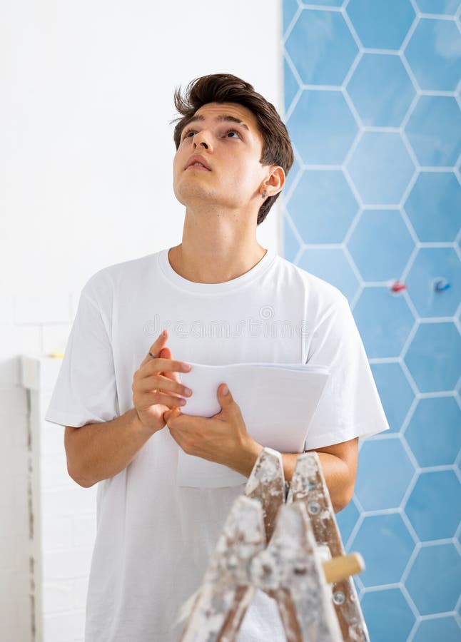 Interested Guy Making Notes while Planning House Overhaul Stock Photo ...