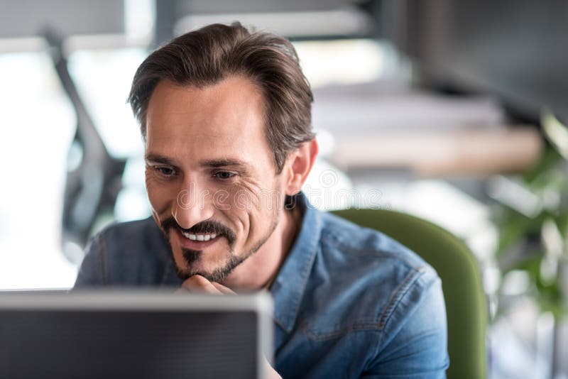 Interested Male Worker Sitting in Office Stock Photo - Image of face ...