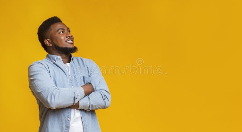 Interested Man Looking Upwards at Copy Space on Yellow Background Stock ...