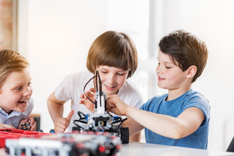 Interested Smiling Children Making Technical Toy Stock Photo - Image of ...