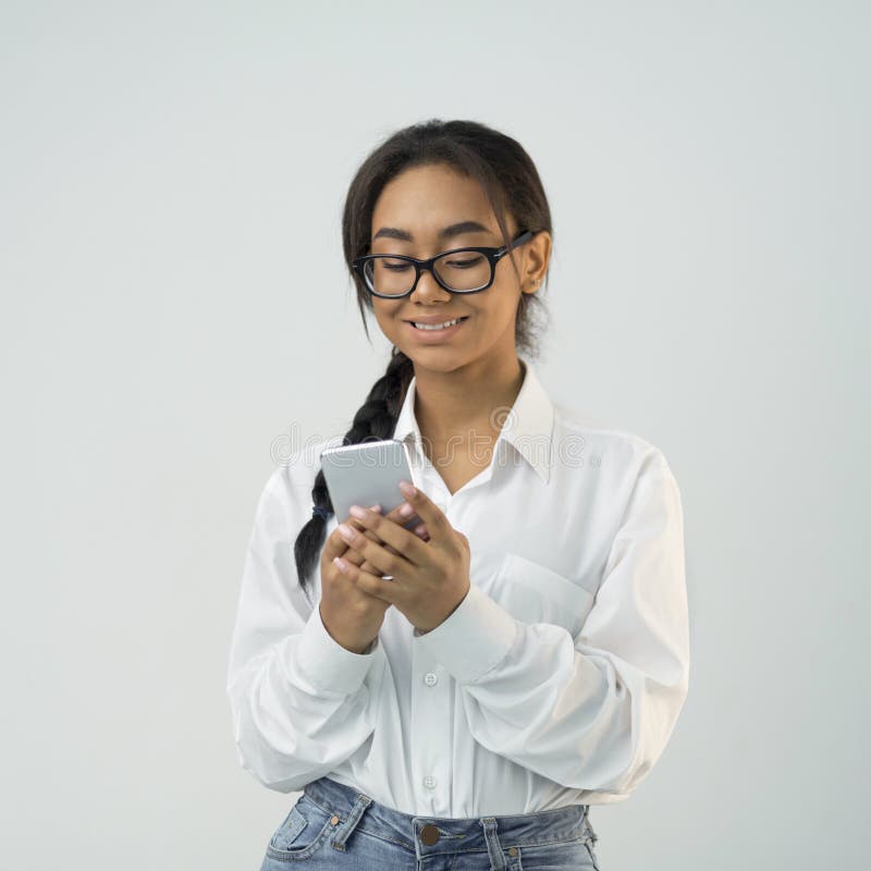 Interested Teen Boy Using Smartphone on Orange Background Stock Photo ...