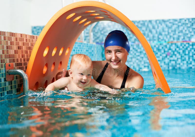 Mother with Baby in Swimming Pool Training Stock Photo - Image of ...
