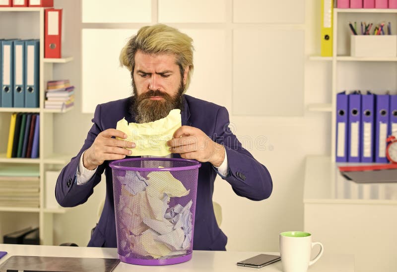 Interesting Info. Man in Office Look for Lost Note in Paper Bin ...