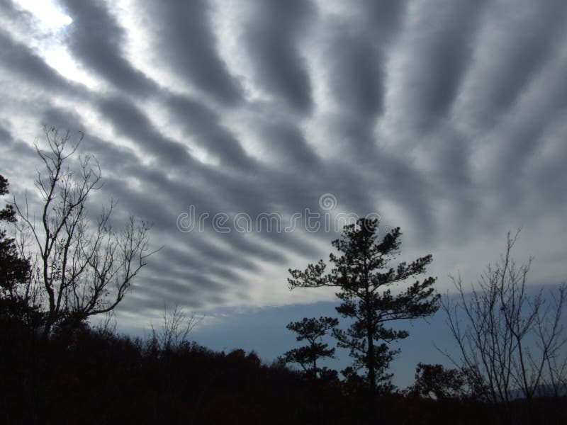 Interesting Linear Cloud Pattern with Mountains Stock Photo - Image of ...