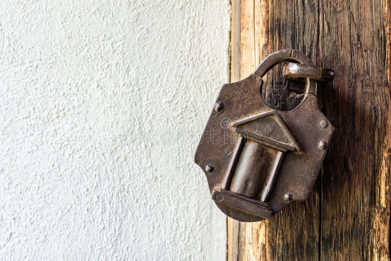 Interesting Old Padlock on a Wooden Medieval Door. Stock Photo - Image ...