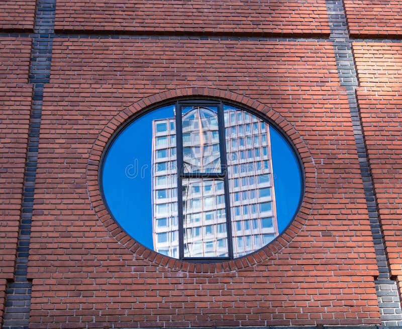 Interesting Reflection of Building in an Oval Window on a Textured ...