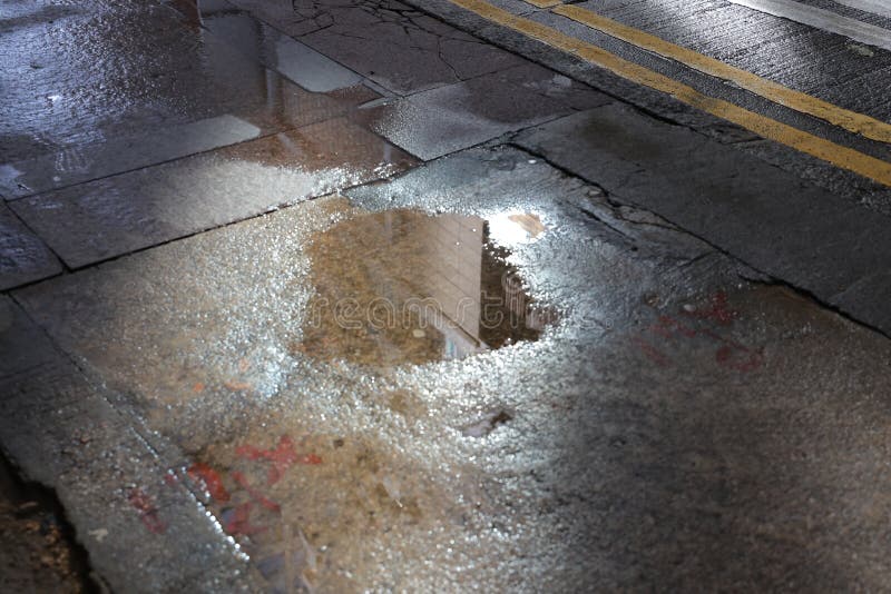 Interesting Reflection in the Puddle on the Ground Block Pavement ...