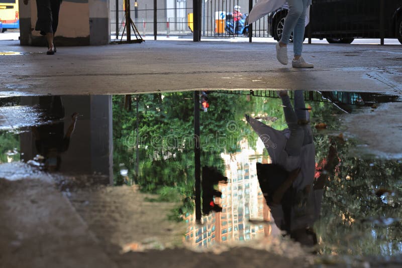 Interesting Reflection in the Puddle on the Ground Block Pavement ...