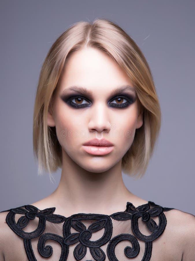 Interesting Studio Light. Blonde Model with Strong Makeup Stock Image ...