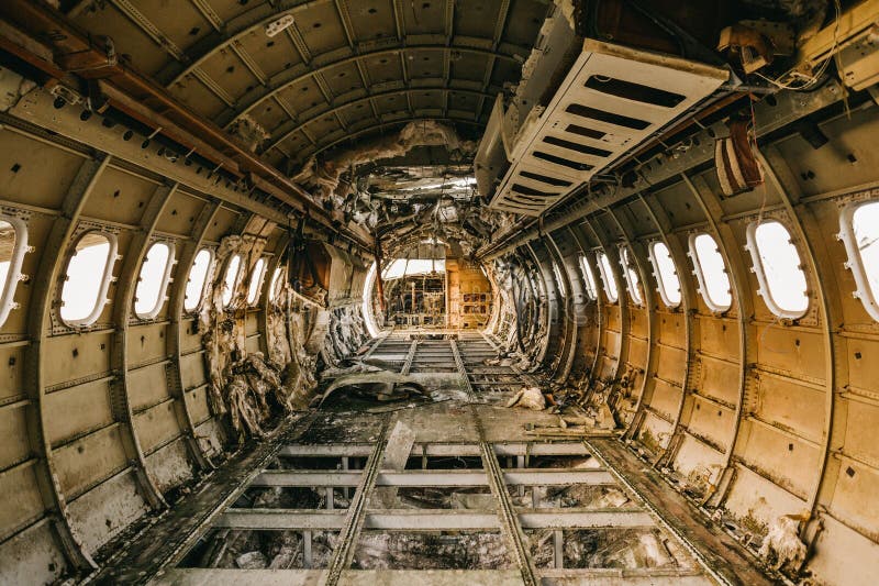 Interior of an Abandoned Airplane Fuselage with Structural Damage and ...