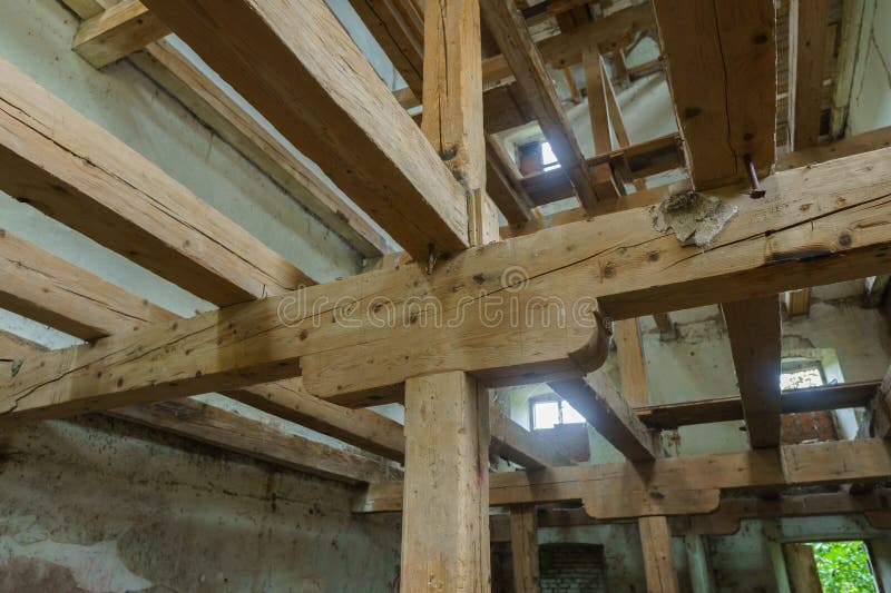 Interior of an Abandoned Structure Highlighting Wooden Beams and Rustic ...