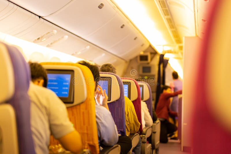 Interior of Airplane with Passengers on Board and Crew. Stock Photo ...