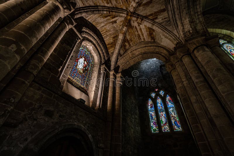 Interior of an Ancient Stone Cathedral with Arches and Strained Glass ...