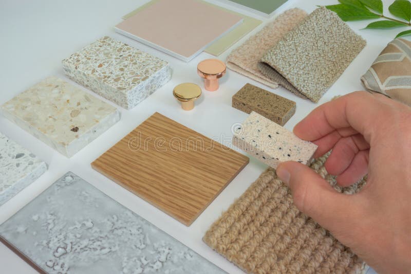 Hand of Interior Architect Placing Sample on a Neutral Contemporary ...