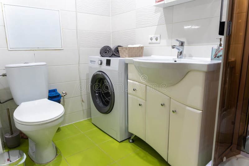 Interior of Bathroom with White Sink, Toilet and Washing Machine Stock ...