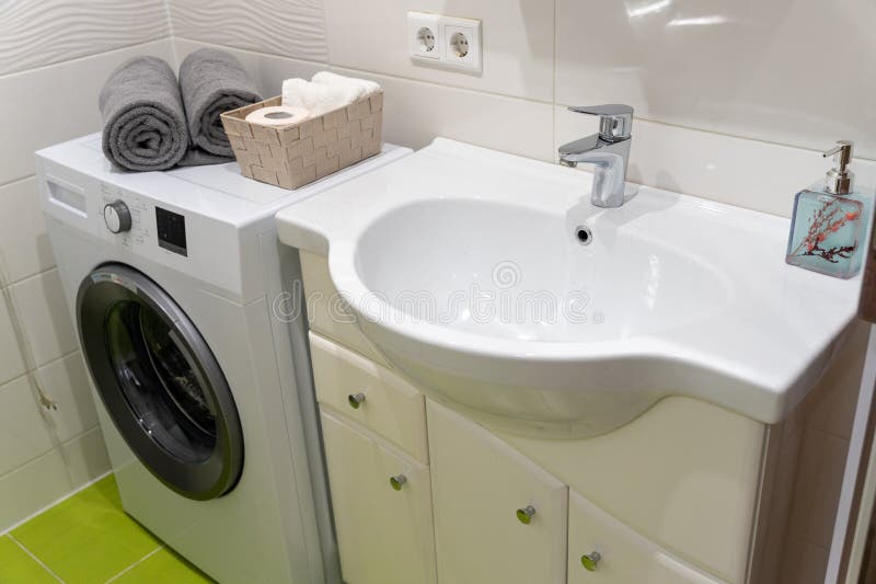 Interior of Bathroom with White Sink and Washing Machine Stock Photo ...