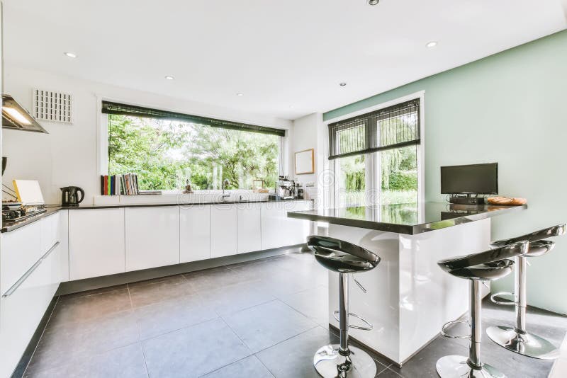 The Interior of a Beautiful Large Kitchen with a White Kitchen Set ...