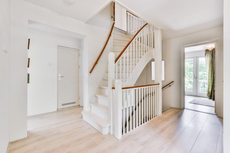 The Interior of a Beautiful White Staircase with Comfortable Handrails ...
