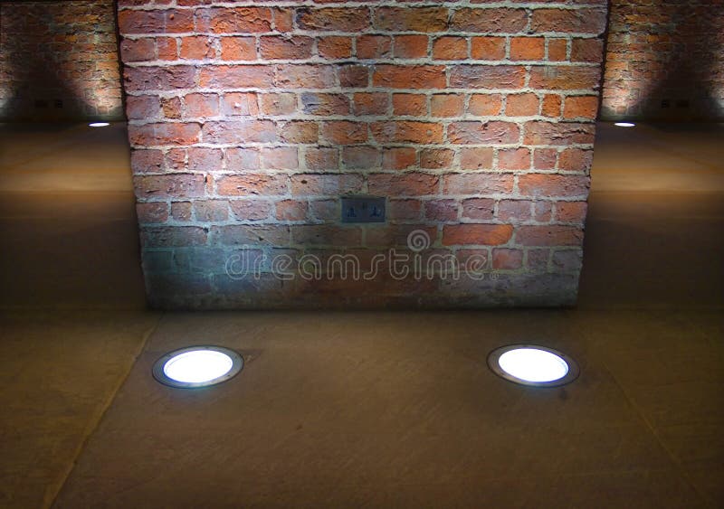 Interior Brick Wall Lit Up by Stock Photo - Image of building, brown ...