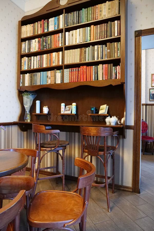 Interior of Cafe with Tables, Chairs and Bookcases Editorial Stock ...