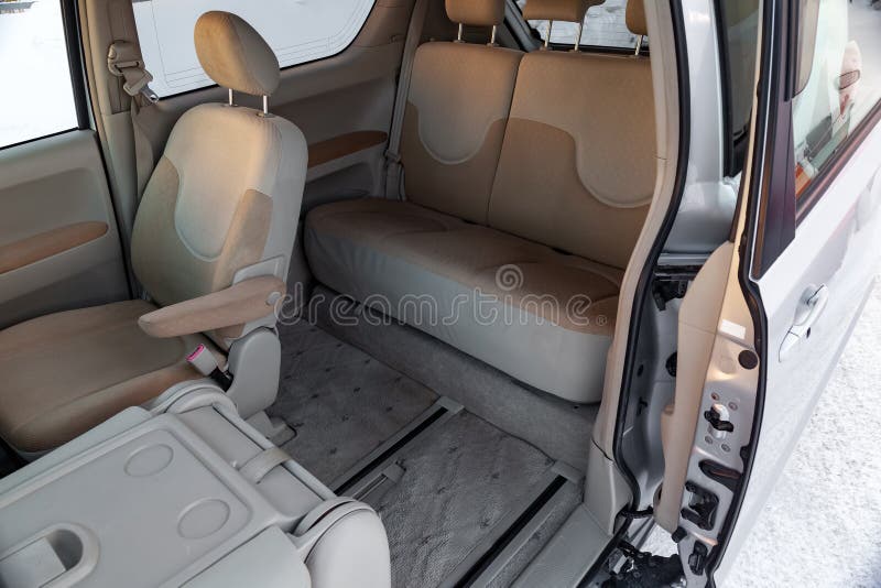 The Interior of the Car in the Back of a Minivan with a Wide Open ...