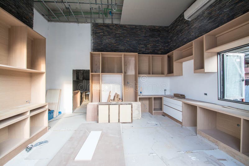 Interior Design Construction of a Kitchen with Cabinet Maker Installing ...