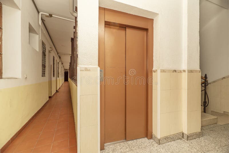 Interior Corridor of a Building with Access Doors To Apartments, Stone ...